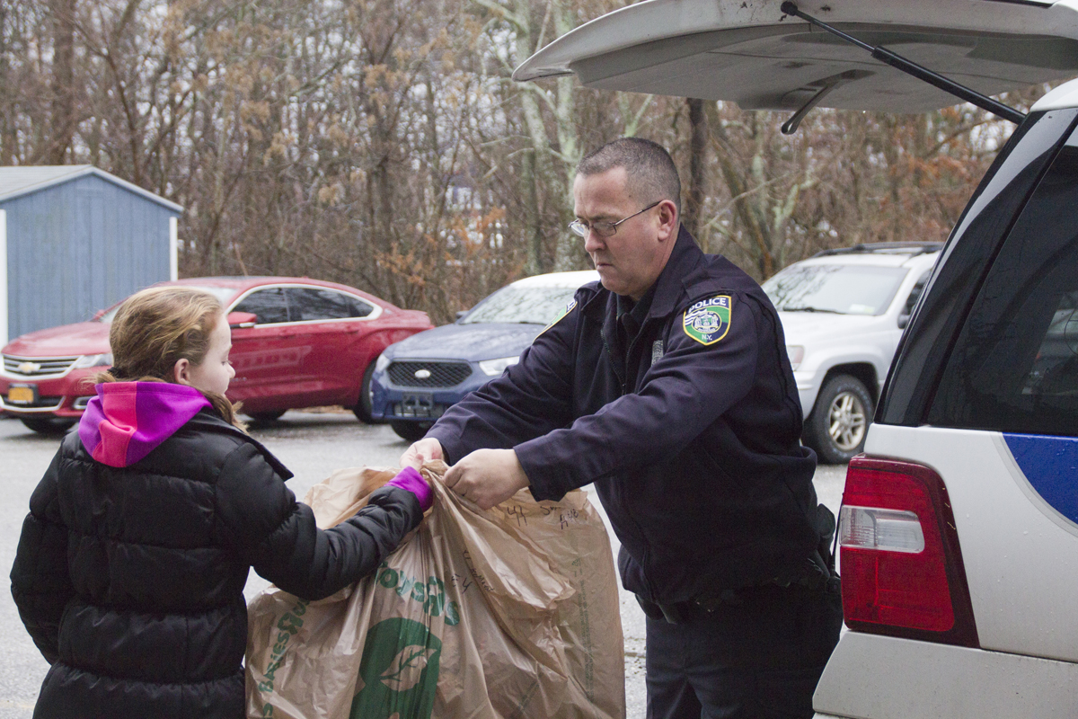 Riverhead police hands out food, presents to needy families - Riverhead ...