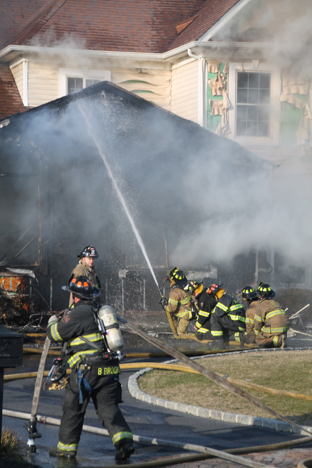 Firefighters battle house fire on Alfred Avenue in Calverton ...